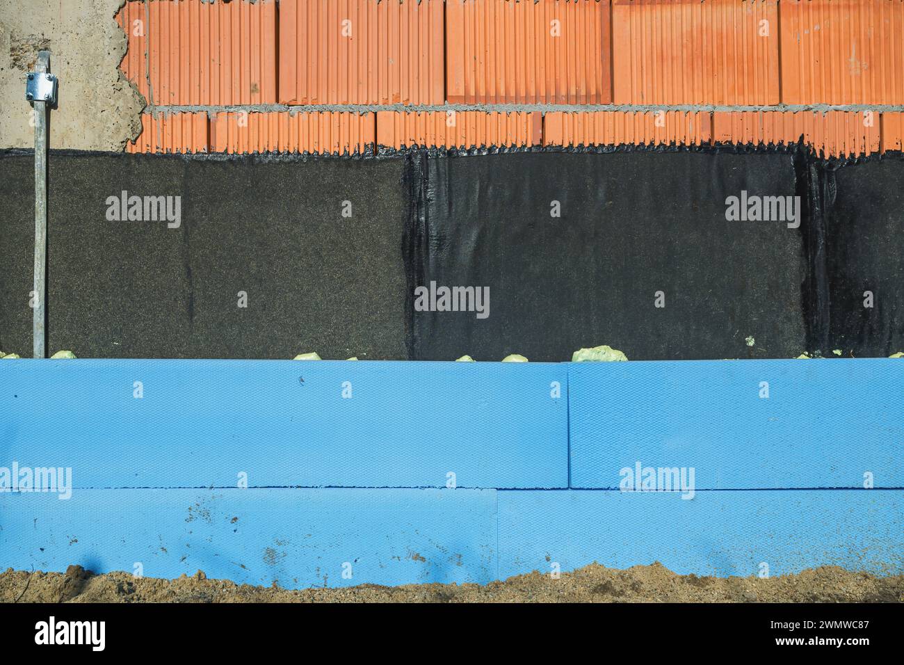 Exterior building wall with waterproofing and thermal insulation layers ...