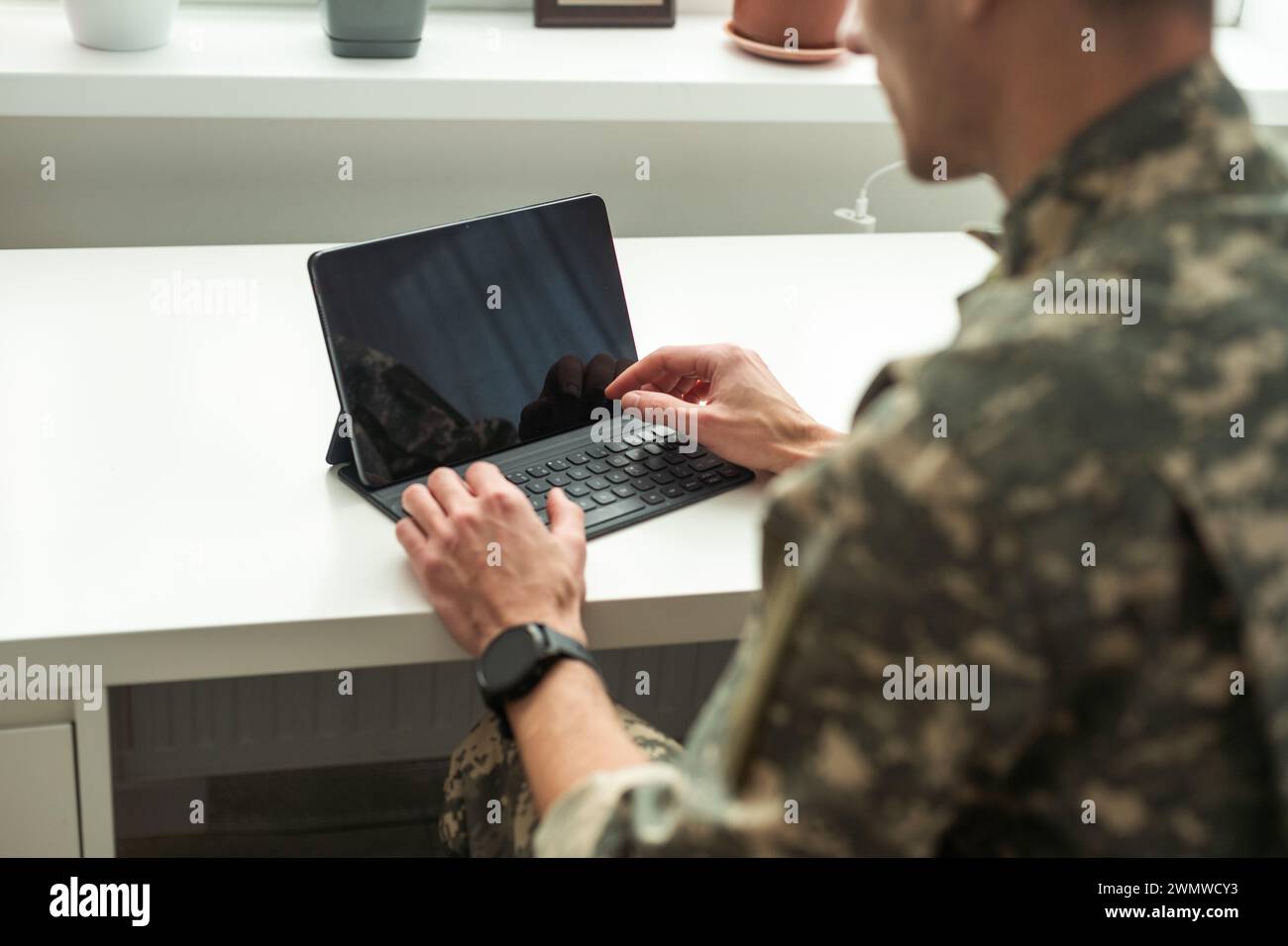 Happy soldier using laptop. Military service Stock Photo - Alamy