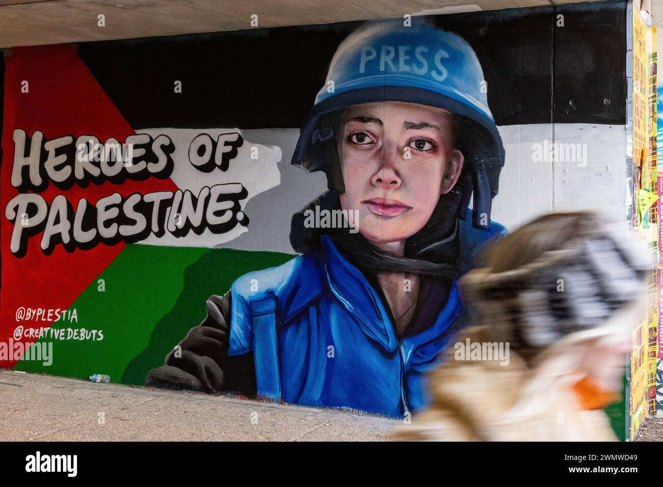 London, UK. 26th February, 2024. A member of the public passes pro ...