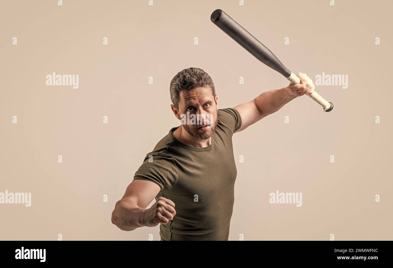 man express aggression beating with bat isolated on grey background ...