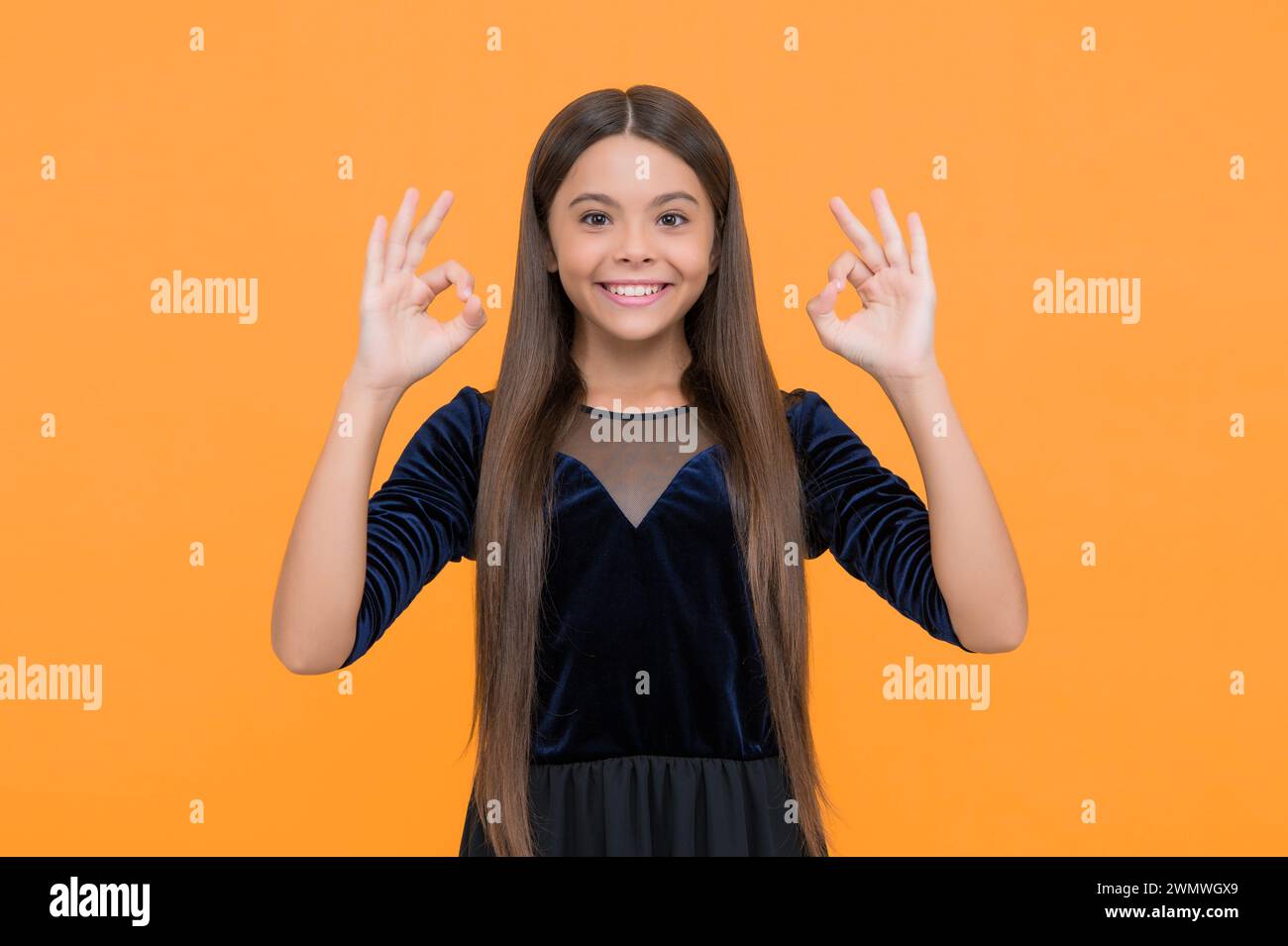All right and alright. Child show OK signs yellow background. Happy ...