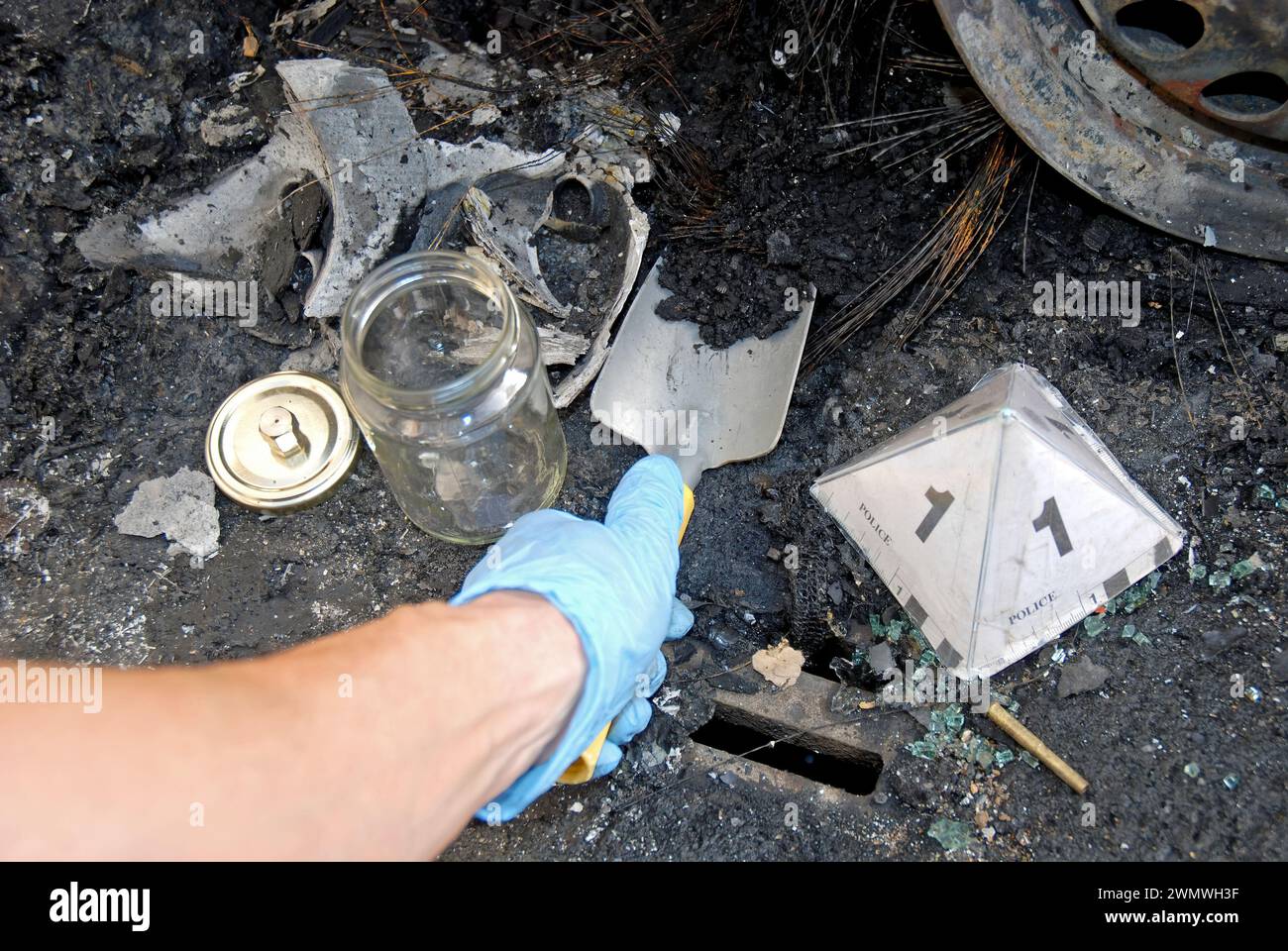 The Scientific Police, CSI, Collecting samples of charred remains ...