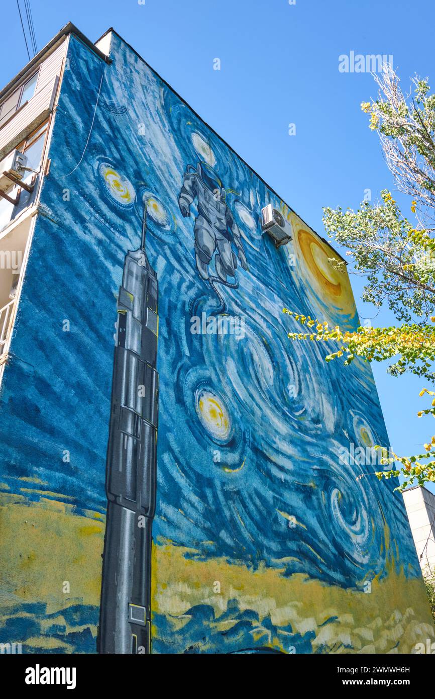 A large mural, combining the Soviet space program at Baikonur with ...