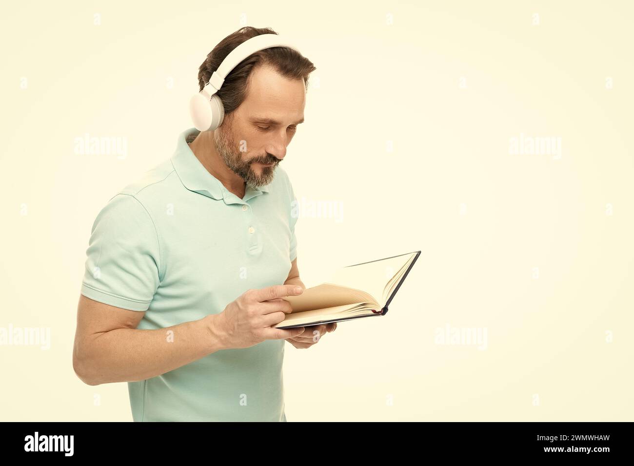 man reading elearning in headphones, advertisement. photo of man ...