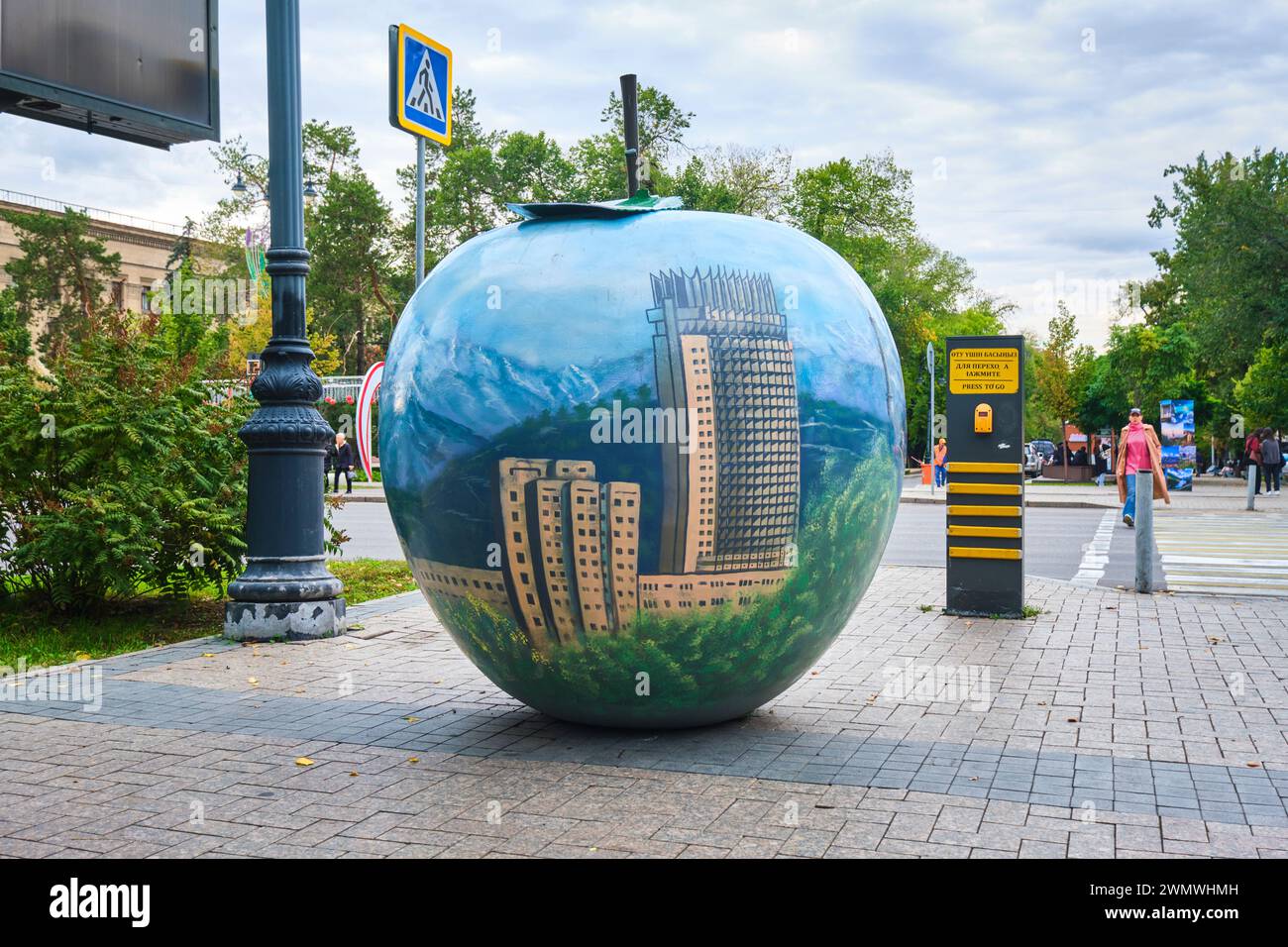 A large, giant painted apple with a famous location of the city, the ...