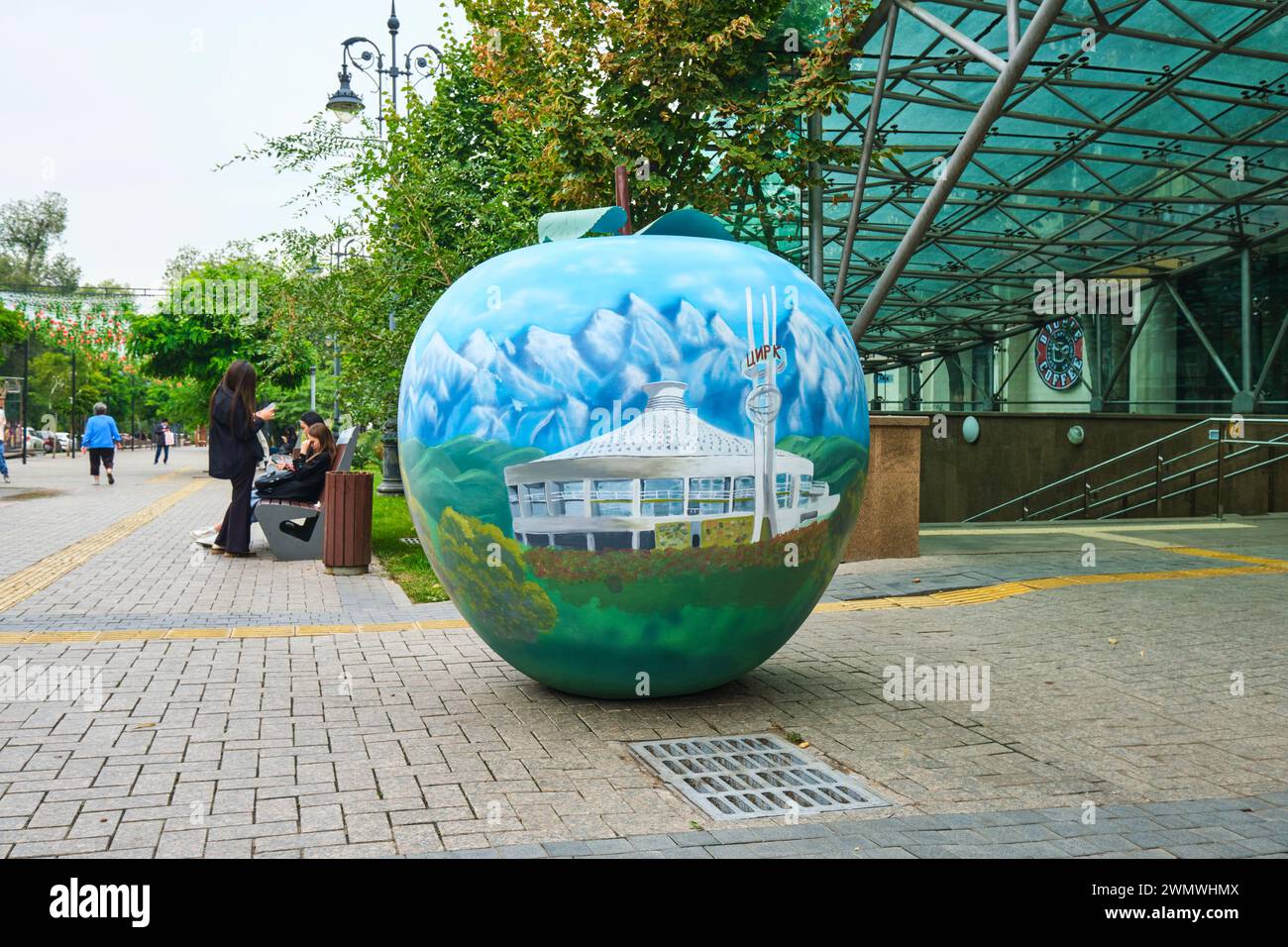 A large, giant painted apple with a famous location of the city, the ...