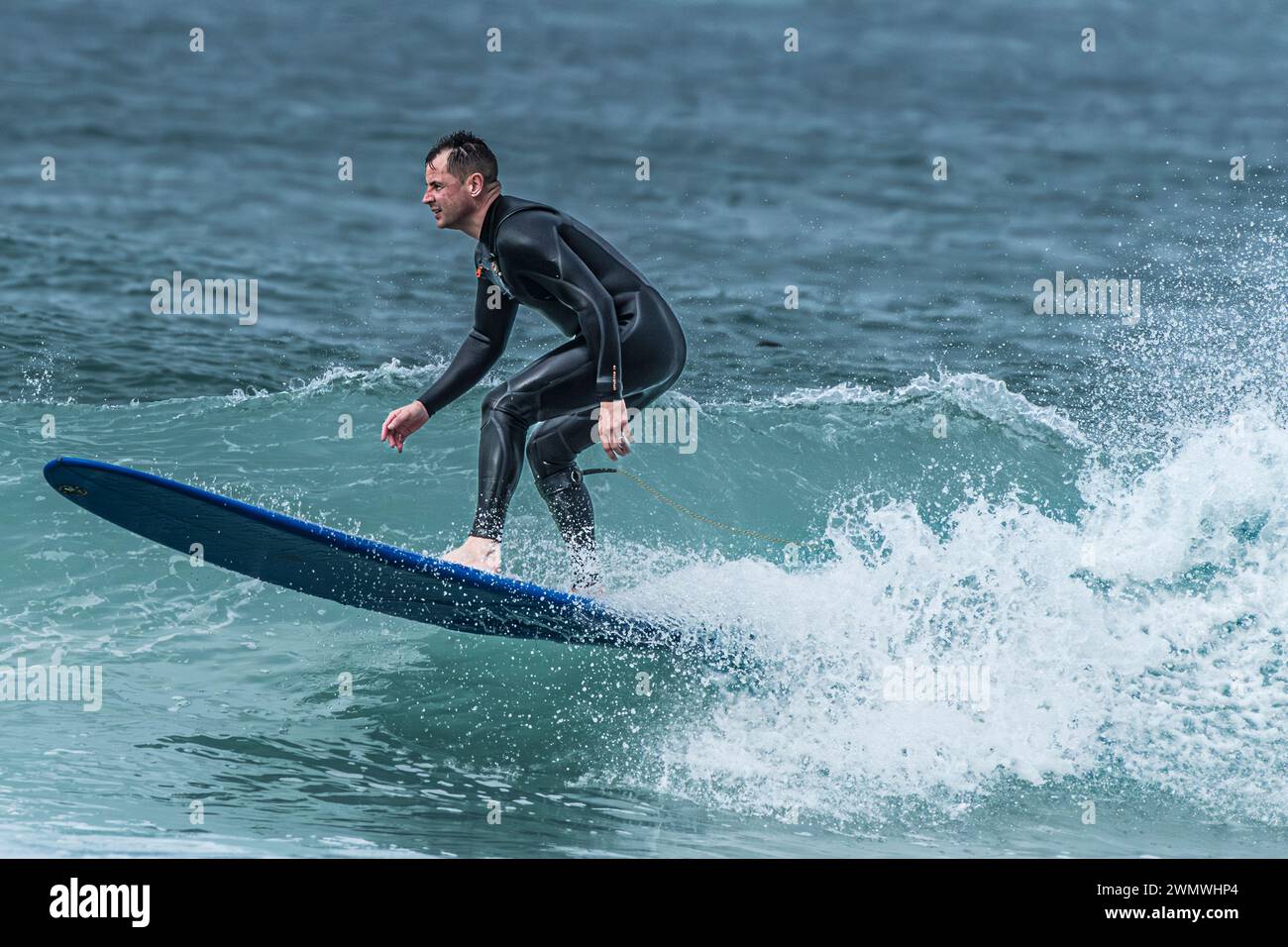 A surfer enjoying spectacular surfing conditions at Fistral in Newquay ...
