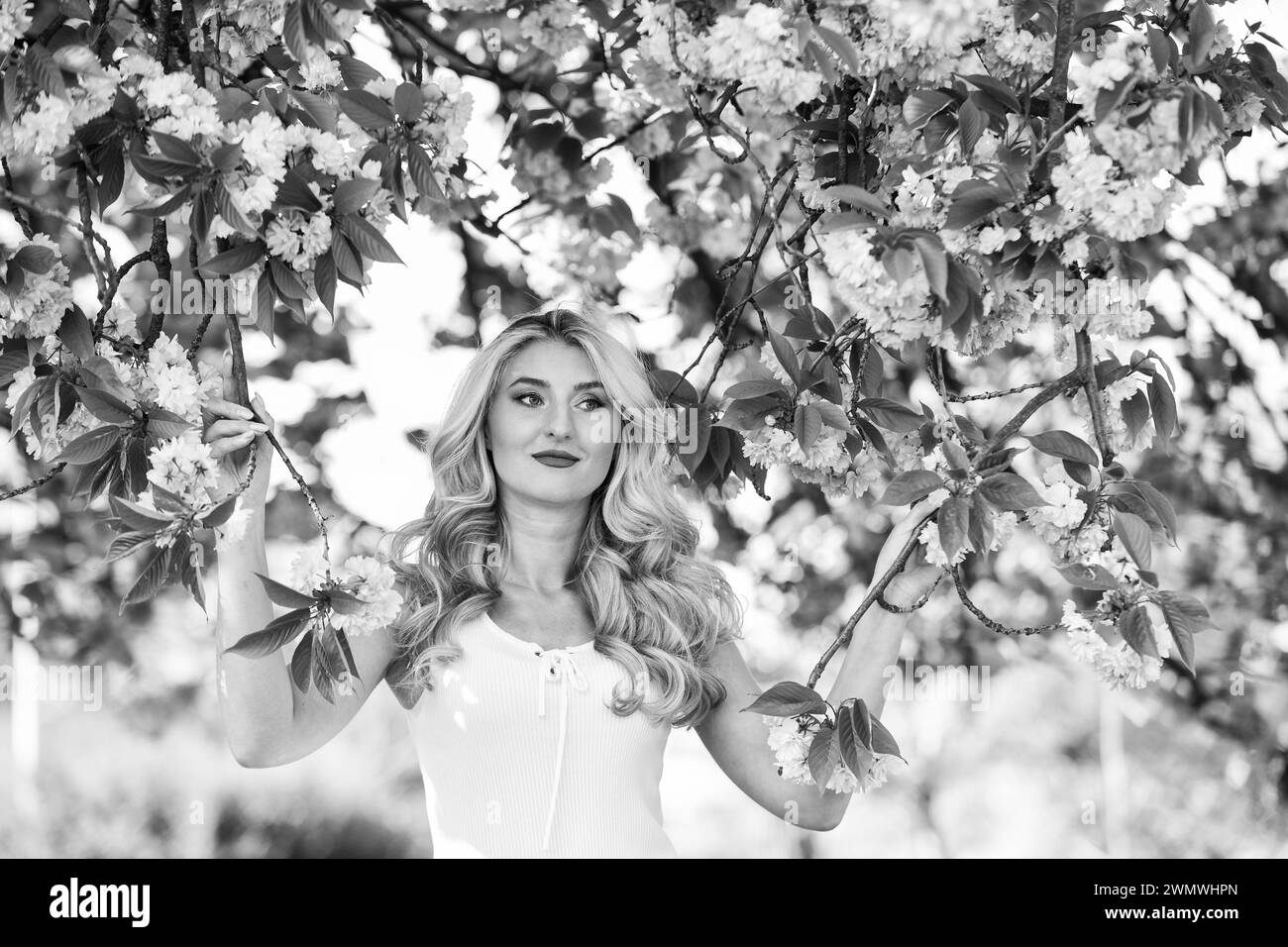 Spring blossoming tree. Happy spring day. Girl enjoy sakura bloom in ...