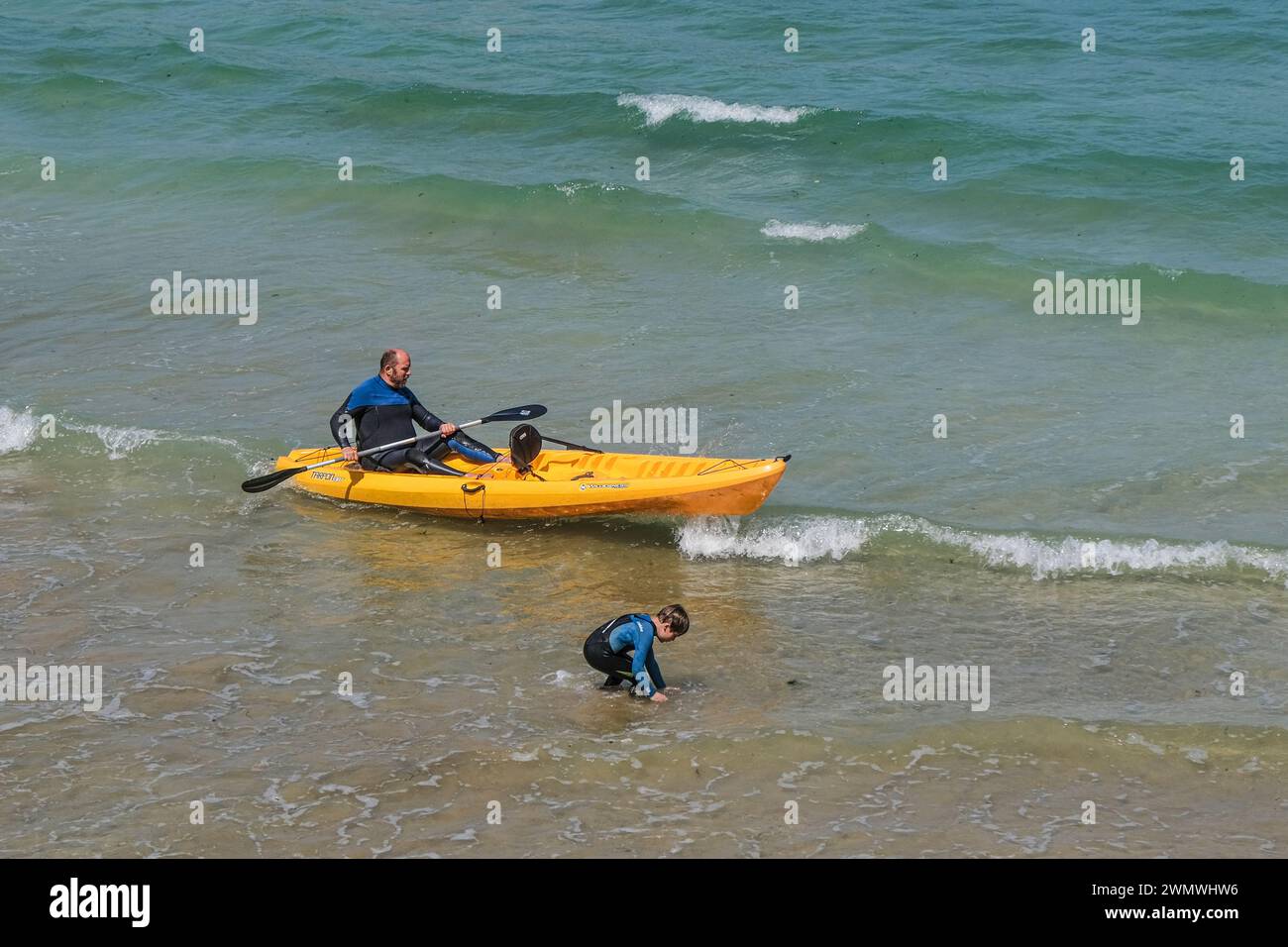 A holidaymaker in a Tarpon 130T kayak in the sea at Towan Beach in ...