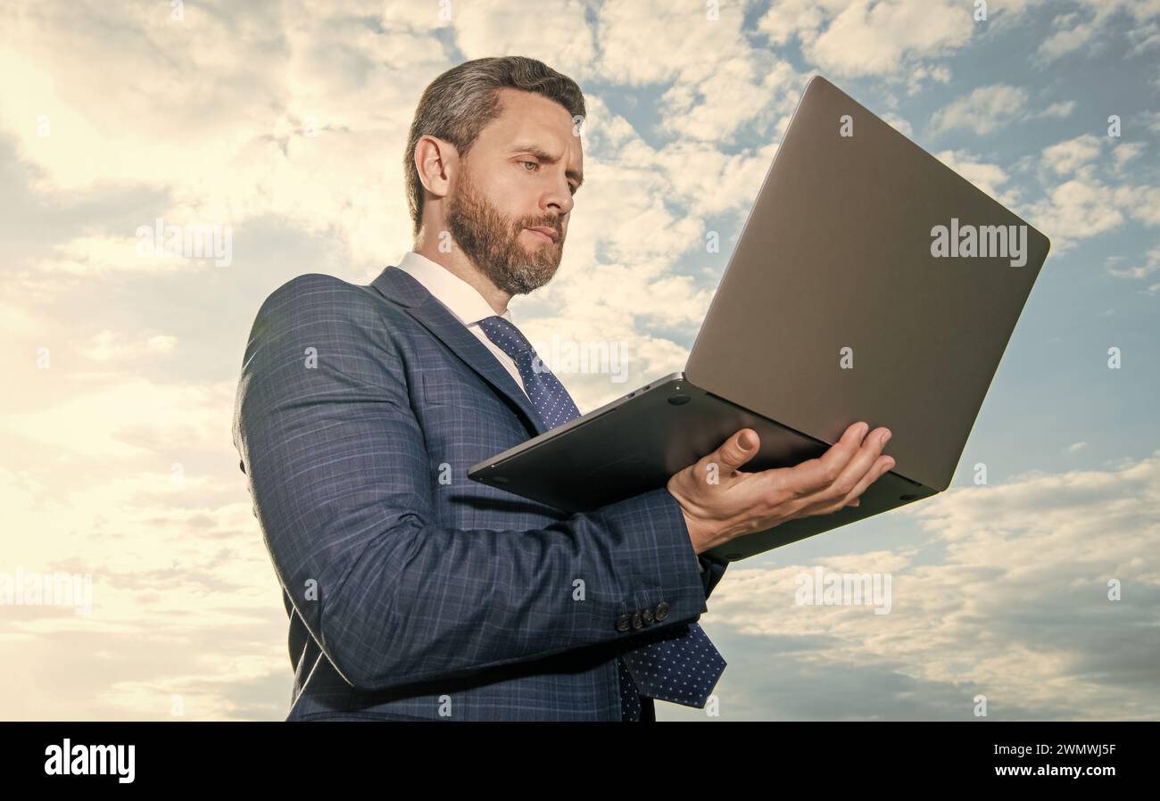 Professional man using computer. Successful businessman working on ...