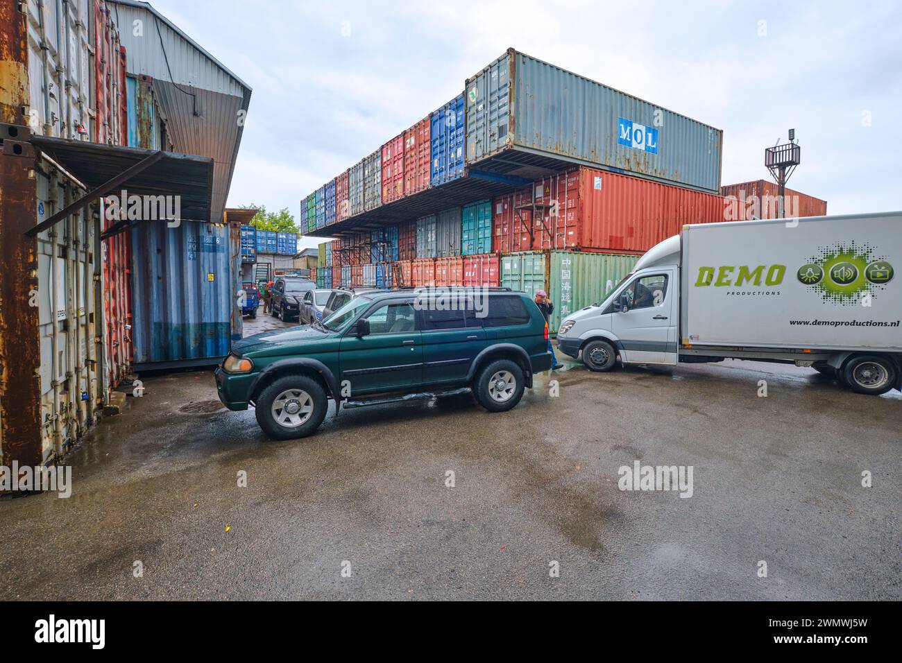 A typical view of the many old, stacked, reused shipping containers ...