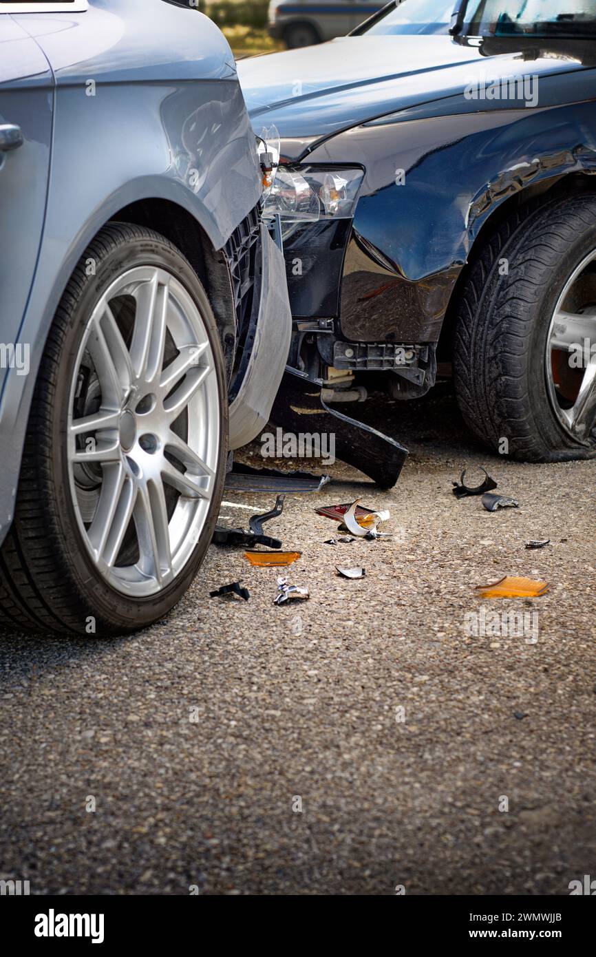 The two luxury cars collide in an accident, scattered broken pieces on ...