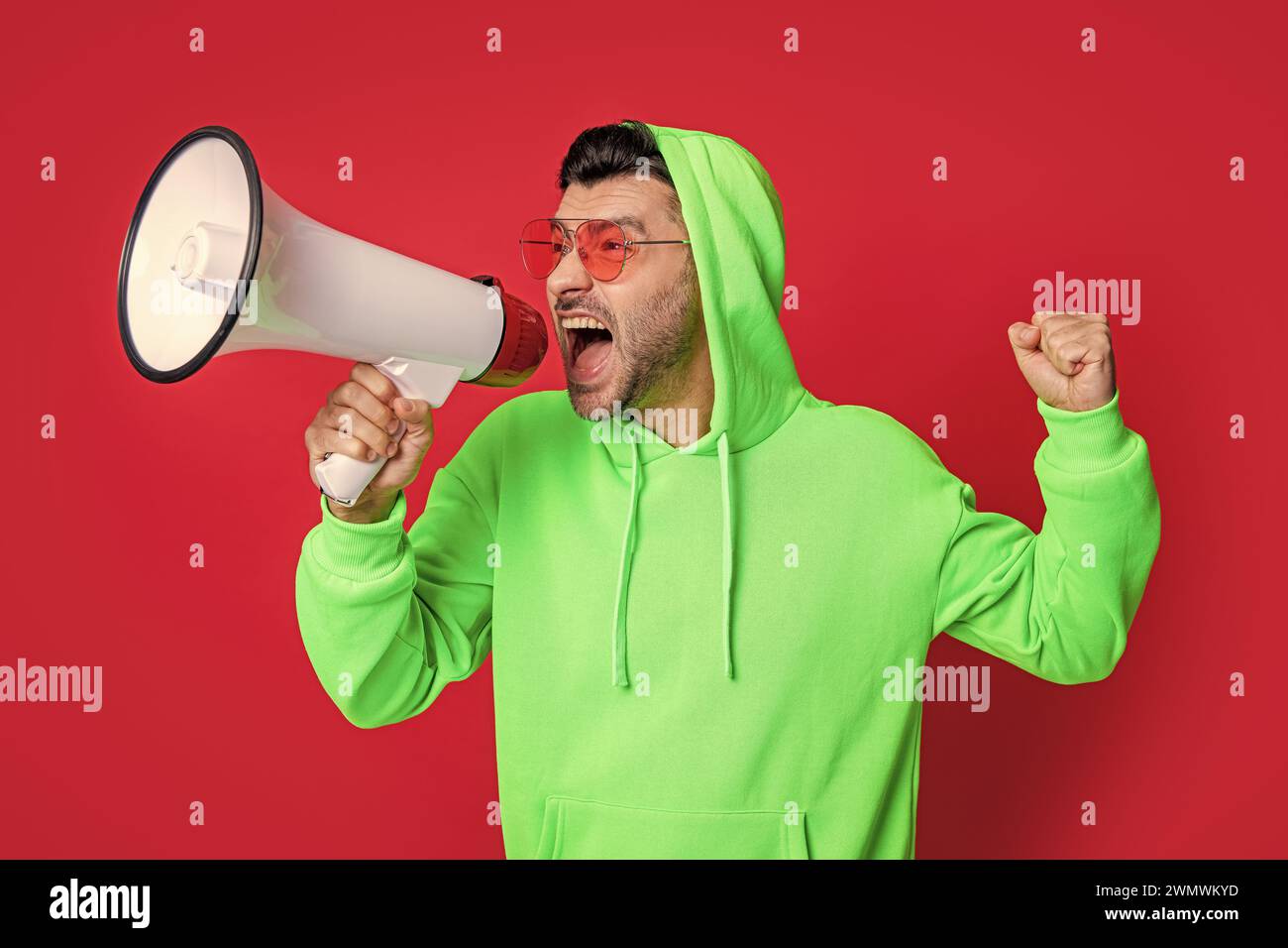 man announcer with loudspeaker in studio. man announcer with ...