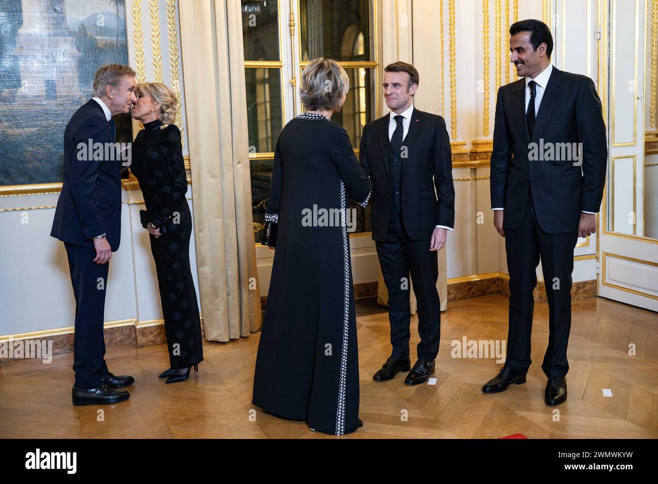 Paris, France. 27th Feb, 2024. CEO of LVMH Bernard Arnault, and his ...