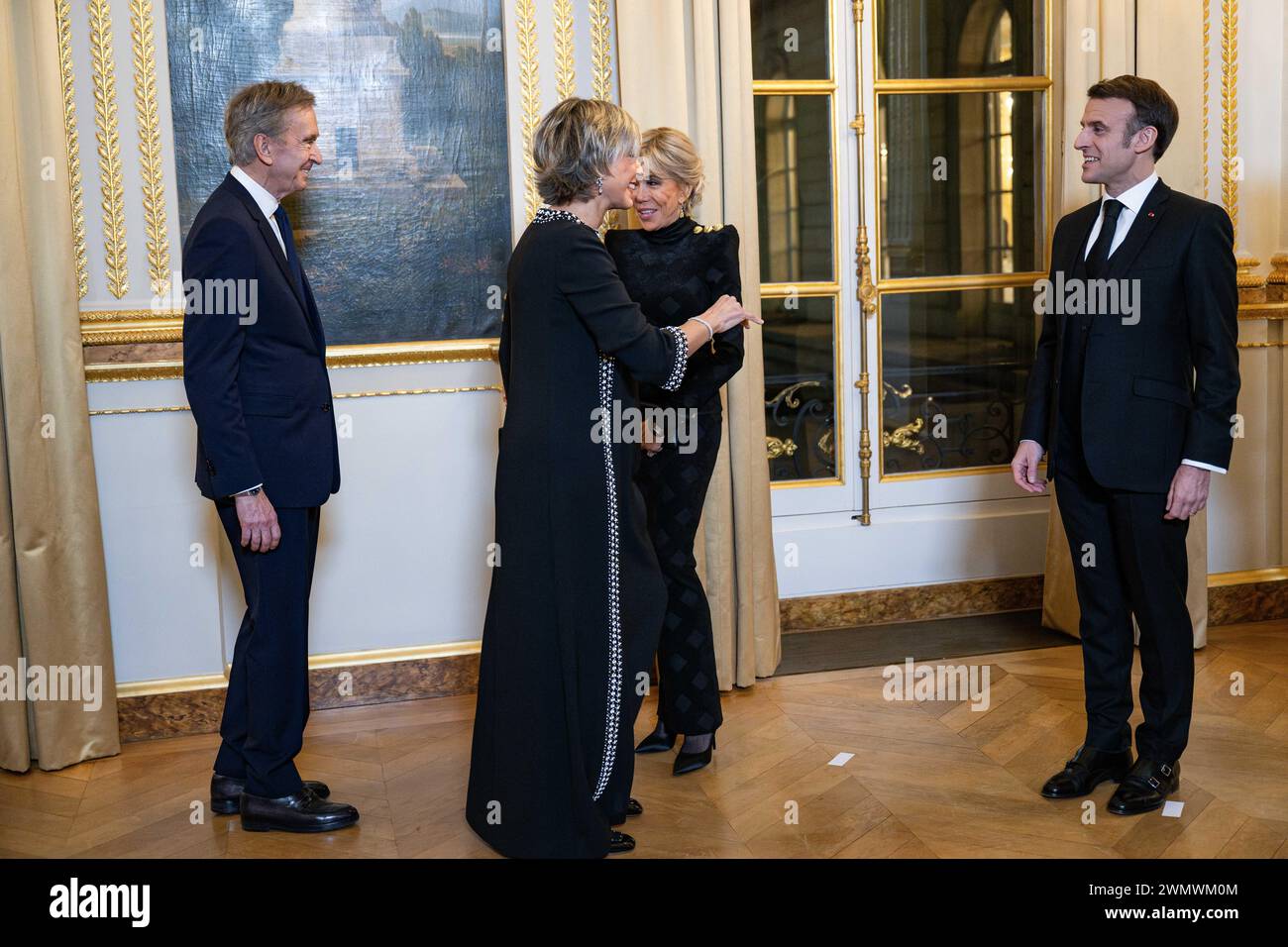 Paris, France. 27th Feb, 2024. CEO of LVMH Bernard Arnault, and his ...
