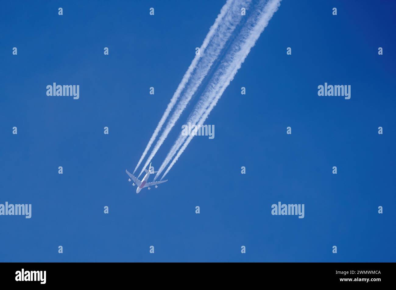 Commercial airplane with four engines in flight high in the sky ...