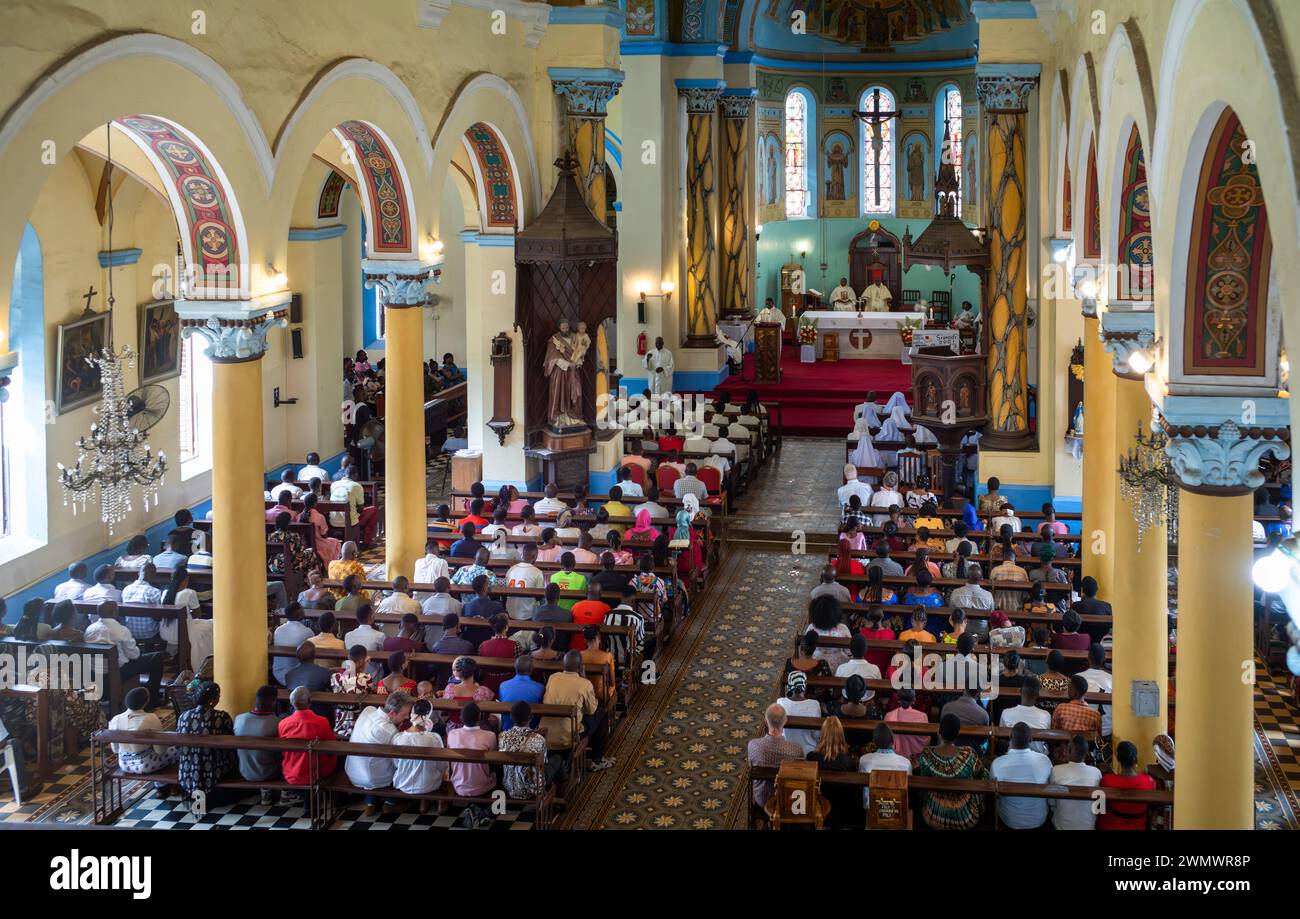 A high view of the colourful congregation at catholic Sunday Mass in St ...