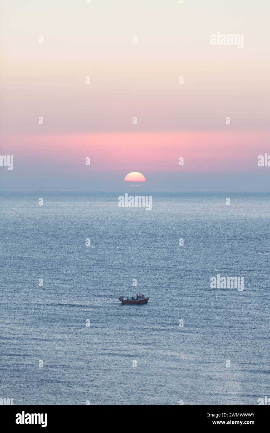 Yorkshire, Robin hoods bay, sunrise and fishing boat out at sea Stock ...