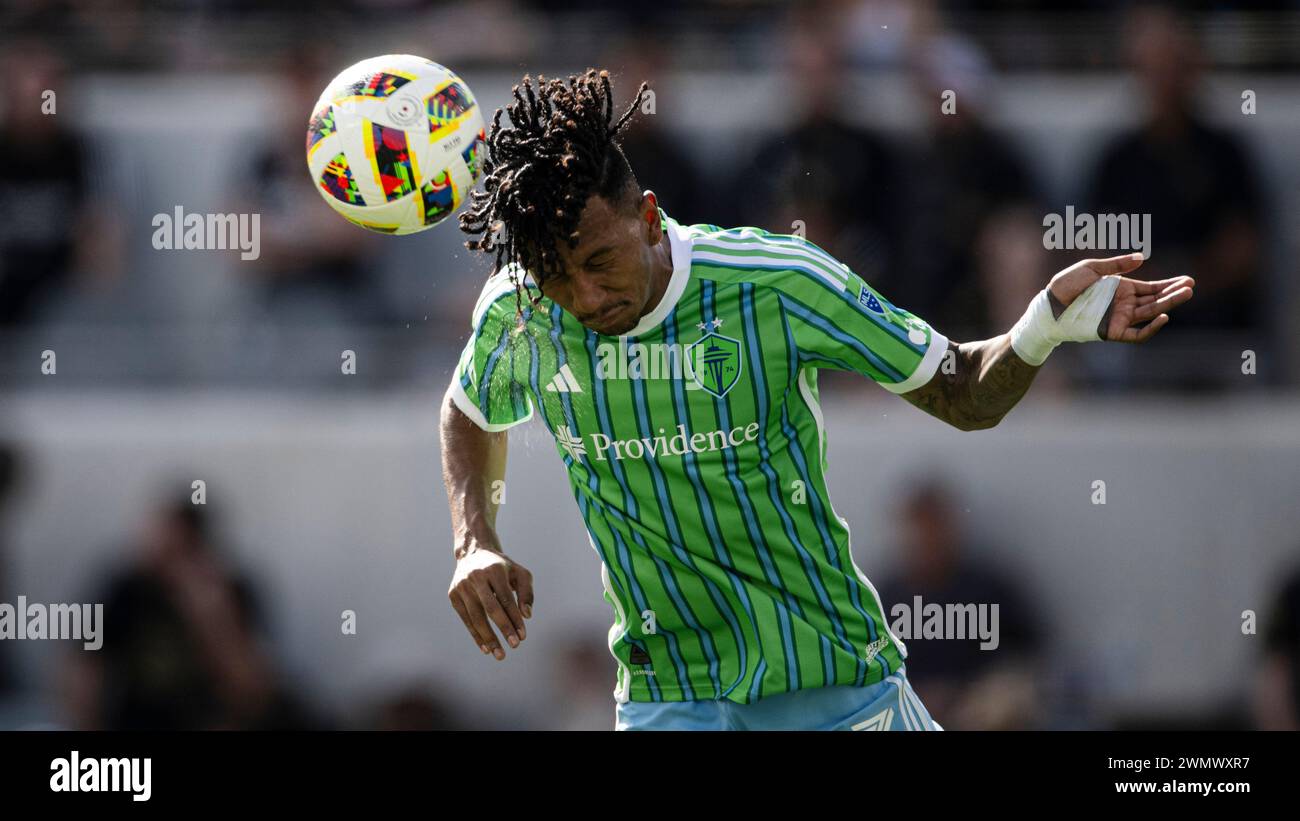 Seattle Sounders midfielder Léo Chú (23) headers the ball during an MLS ...