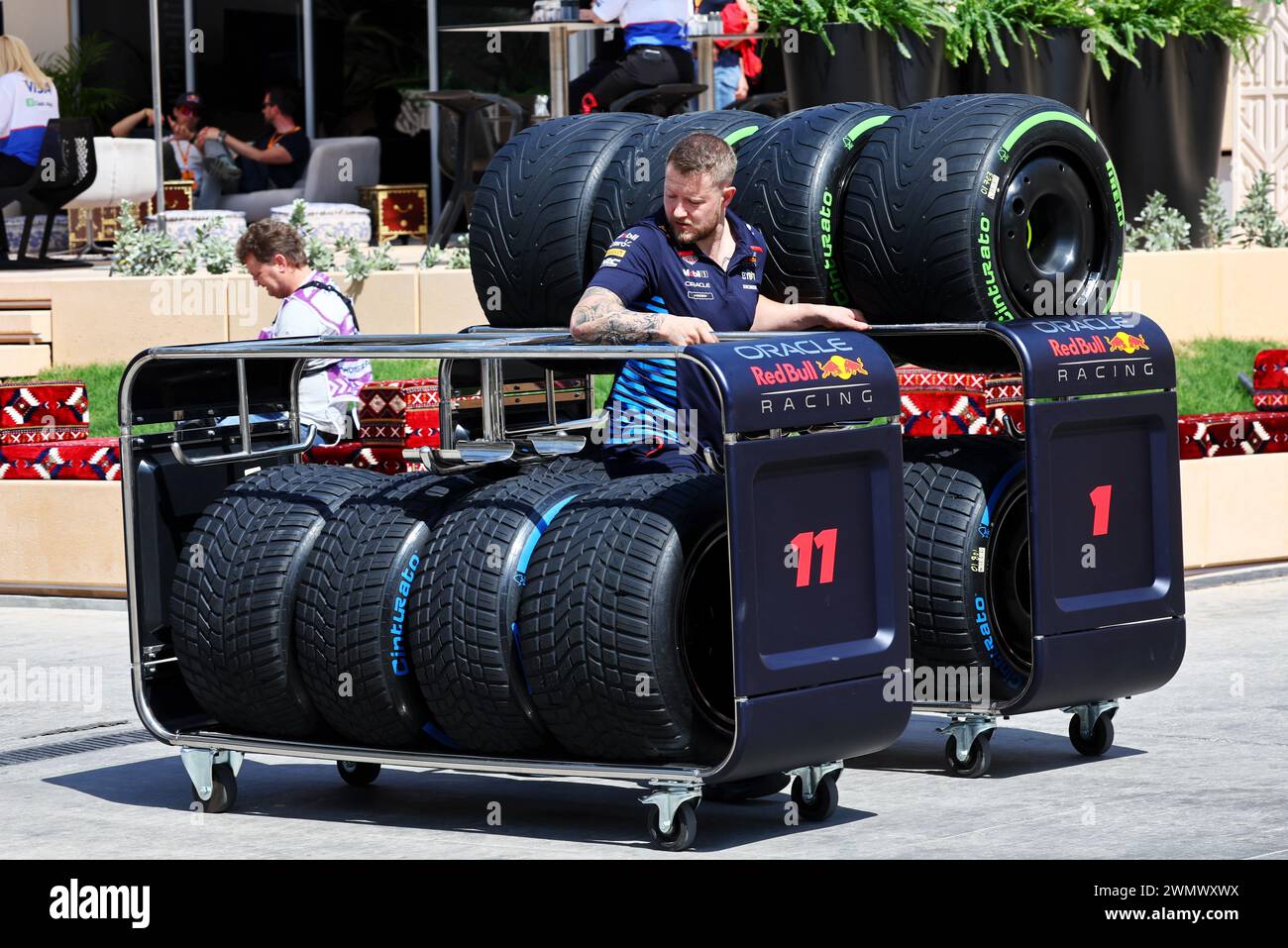 Sakhir, Bahrain. 28th Feb, 2024. Red Bull Racing mechanic with wet and ...