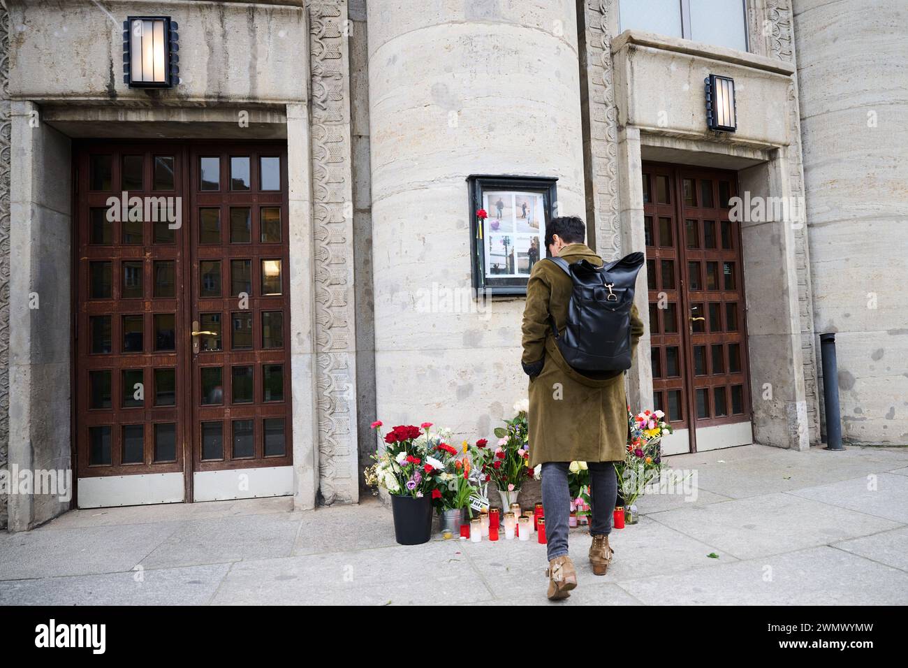 Berlin, Germany. 28th Feb, 2024. A woman looks at the flowers and ...
