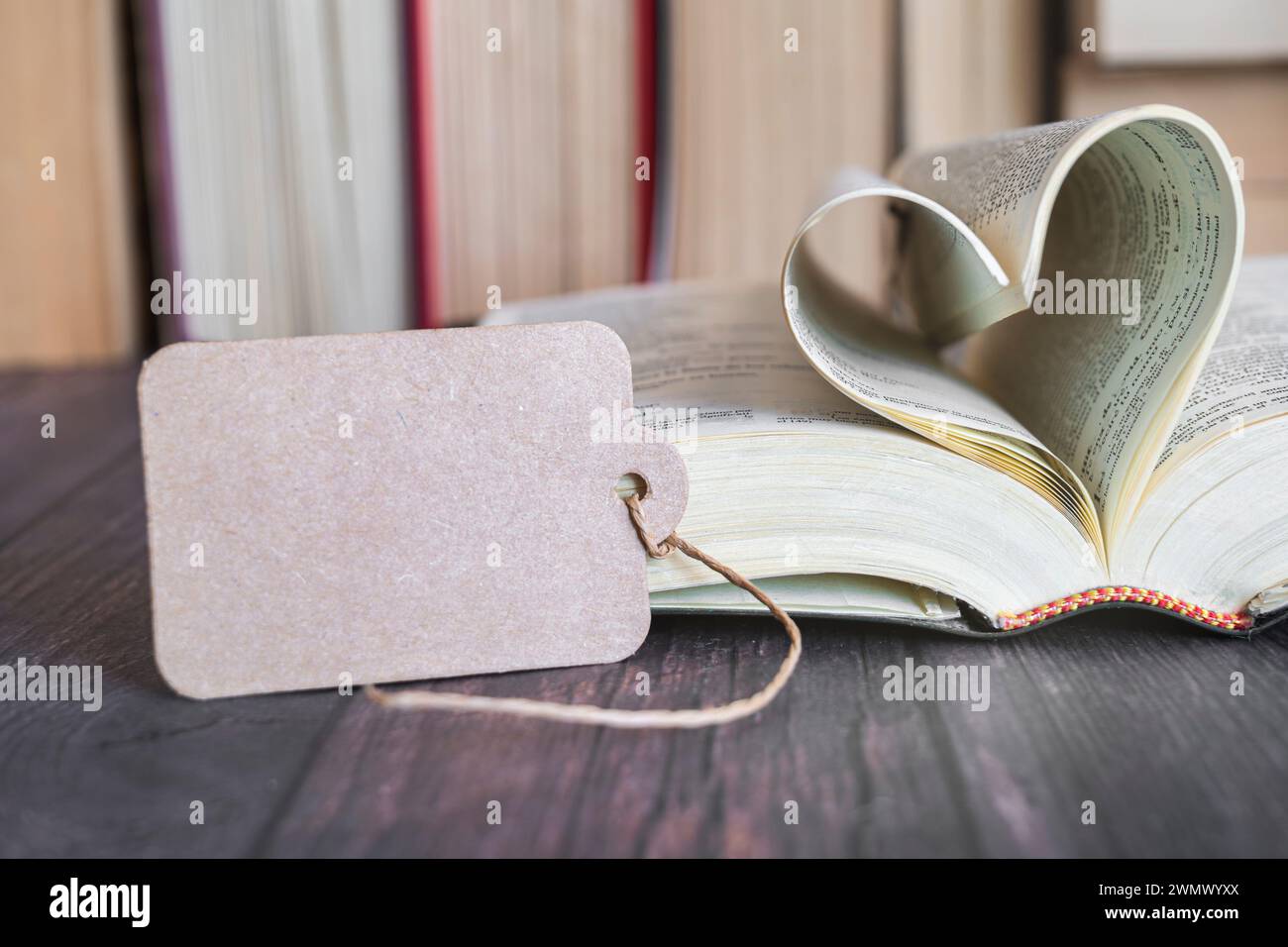 Open book, heart-shaped pages, card on one side, between books ...