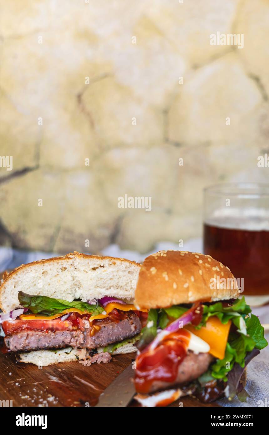 Gourmet split hamburger, fries and beer; appetizing composition, fast ...