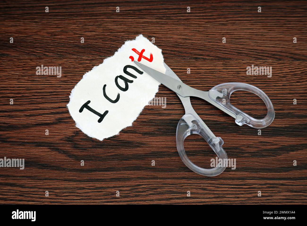 Scissors cut the word t or can't. I can do it concept for self ...