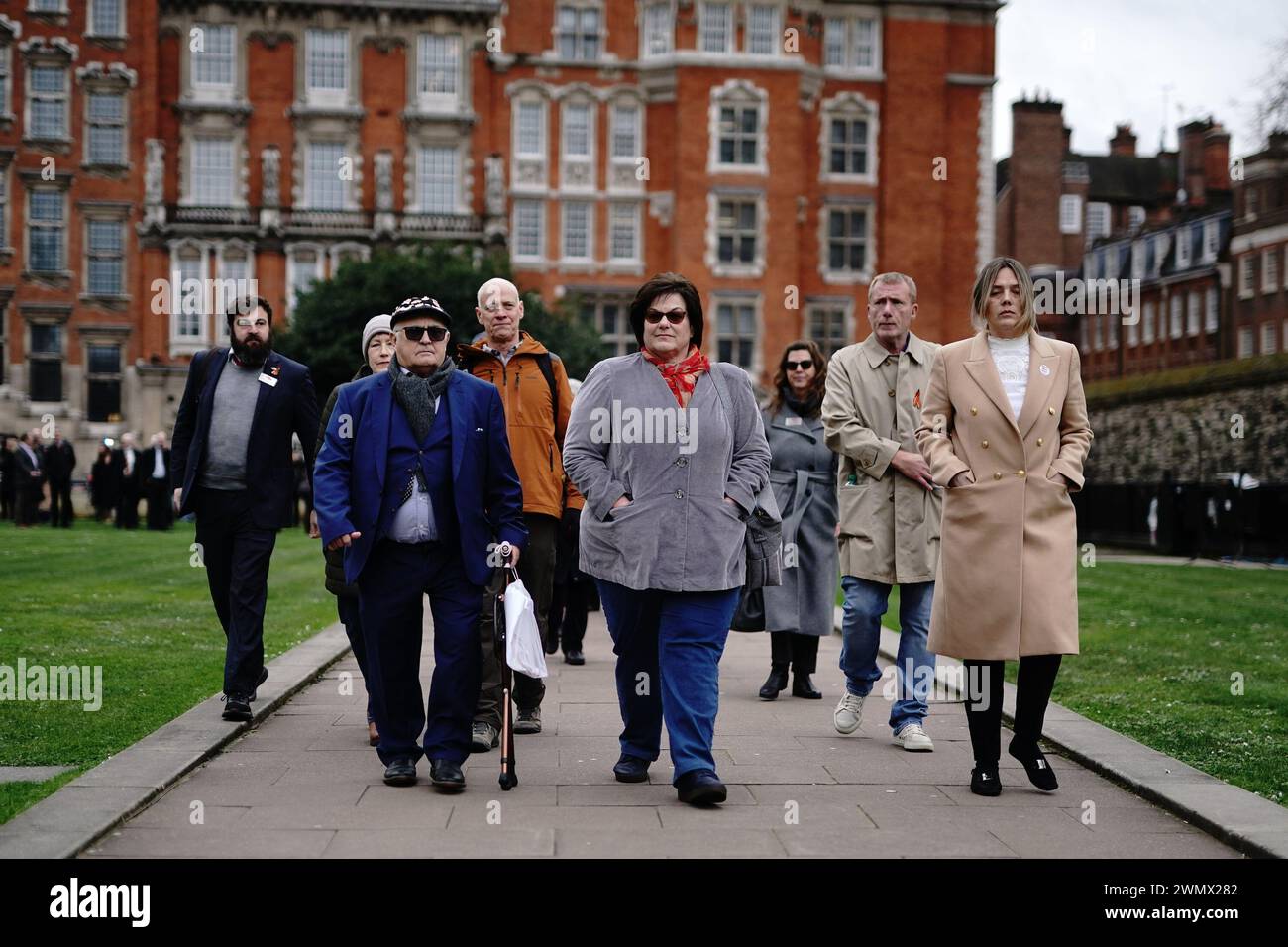 Infected blood victims and campaigners make their way to Westminster ...