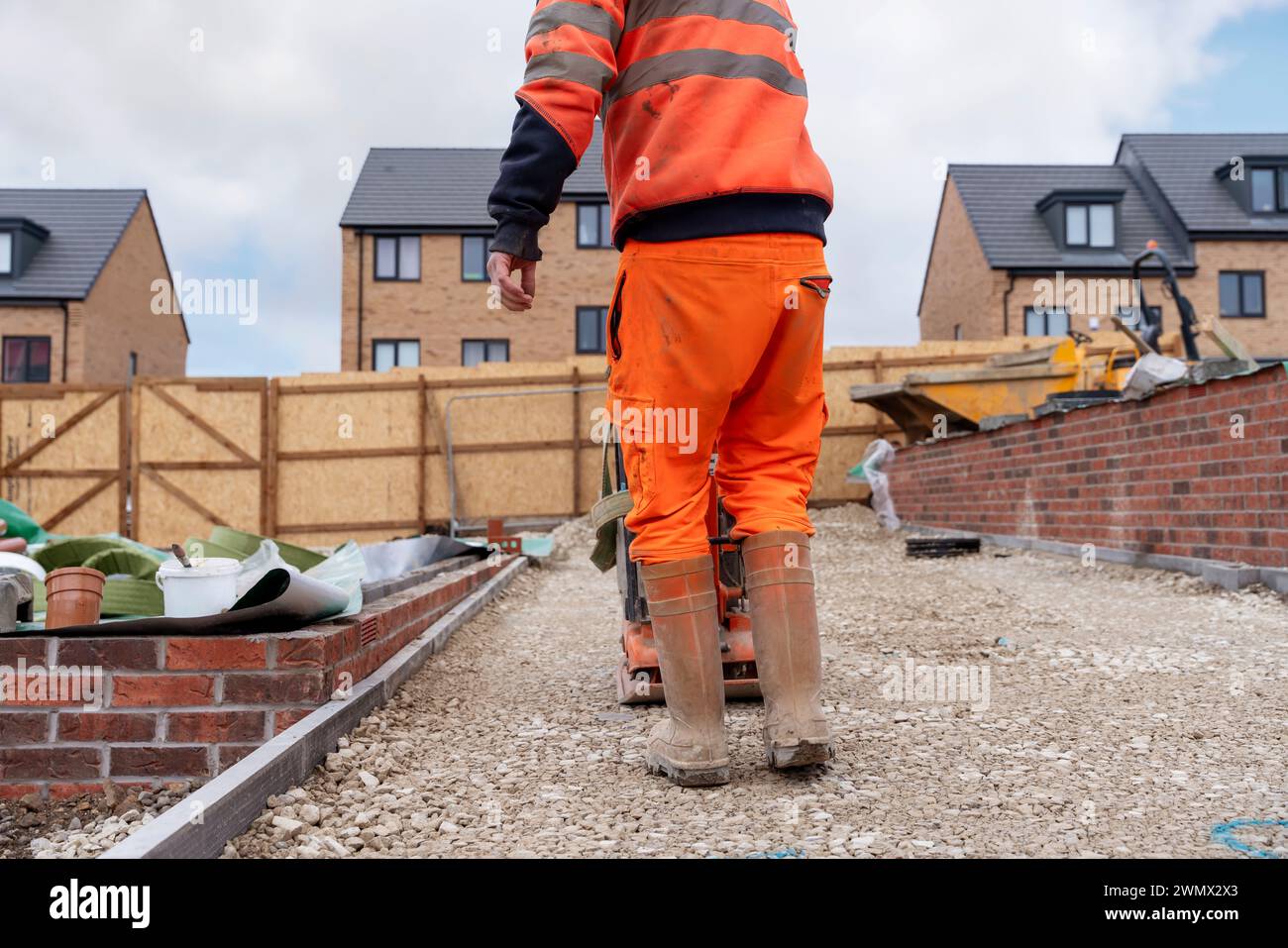 New house and private parking space driveway construction. Builder ...