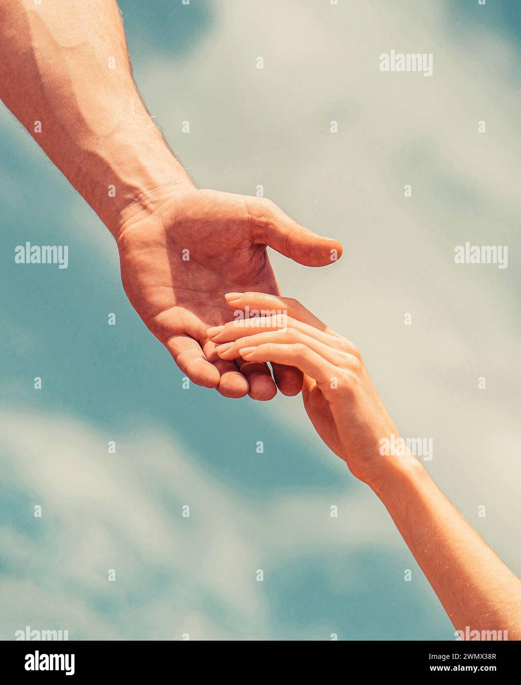 Couple of helping and praying hand on sky background. Giving a helping ...