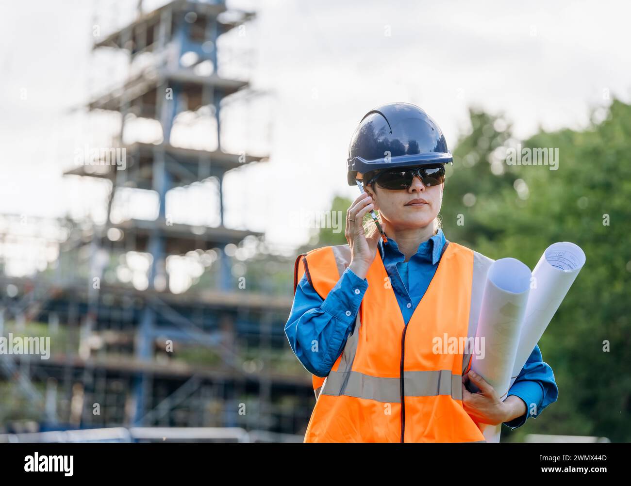 Female site engineer surveyor working with theodolite total station EDM ...