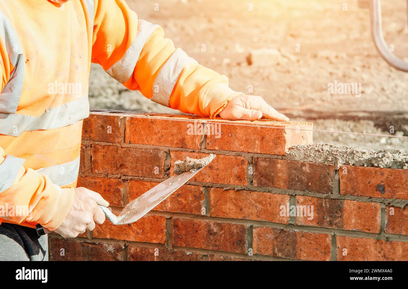 Applying wet cement brick hi-res stock photography and images - Alamy