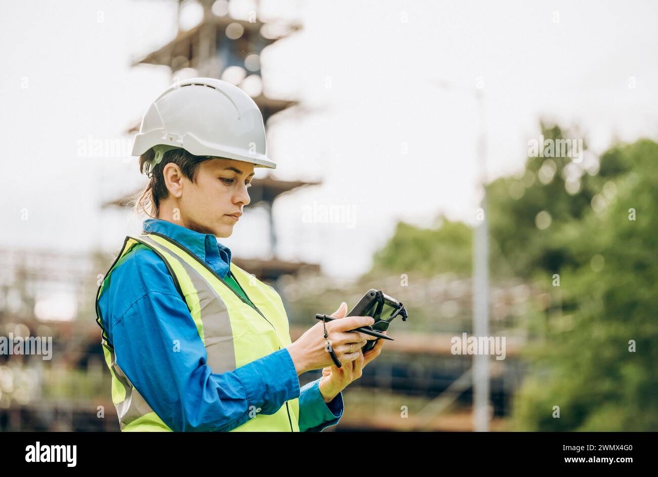 Female site engineer surveyor working with theodolite total station EDM ...
