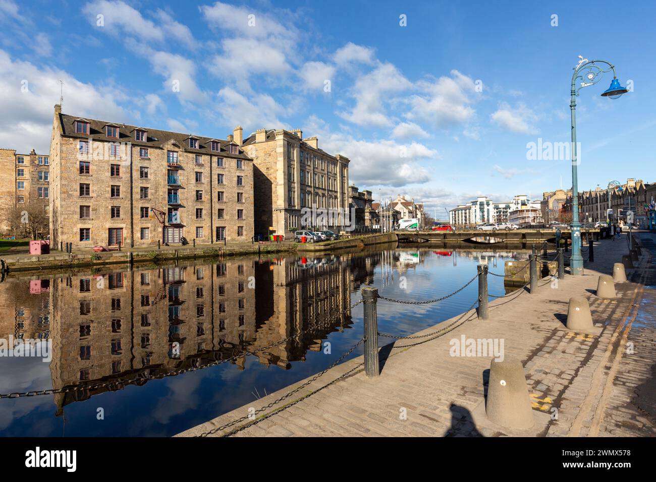 Buildings reflecting in The Water of the Leith, Edinburgh, Scotland ...