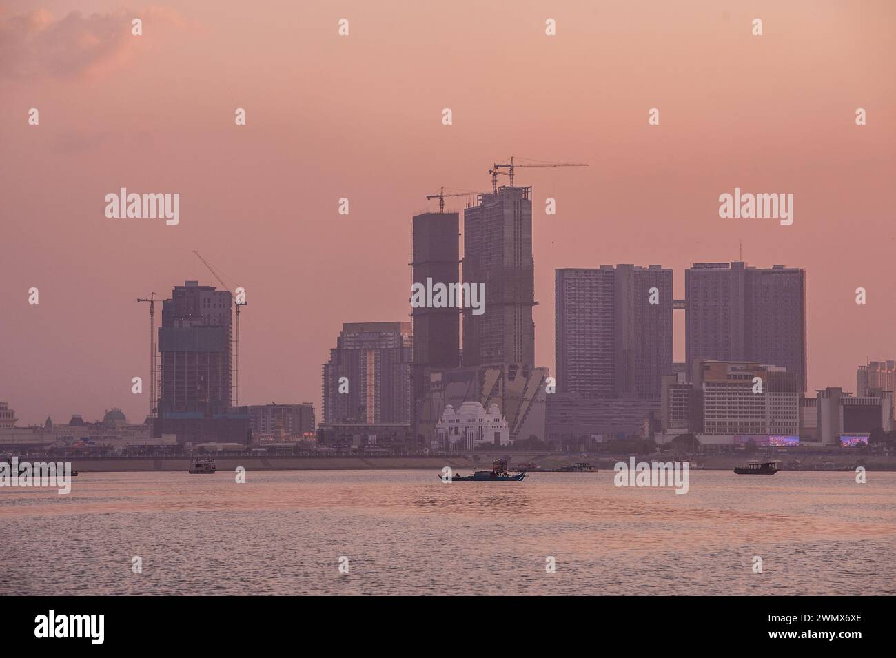Air pollution, smog & dust, shrouds Diamond Island (Koh Pich) at dusk ...