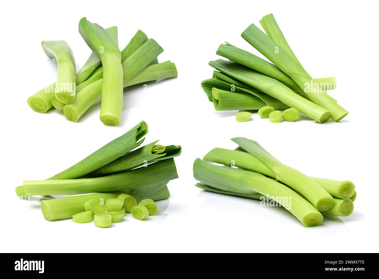 young green garlic leaves isolated on white background Stock Photo - Alamy