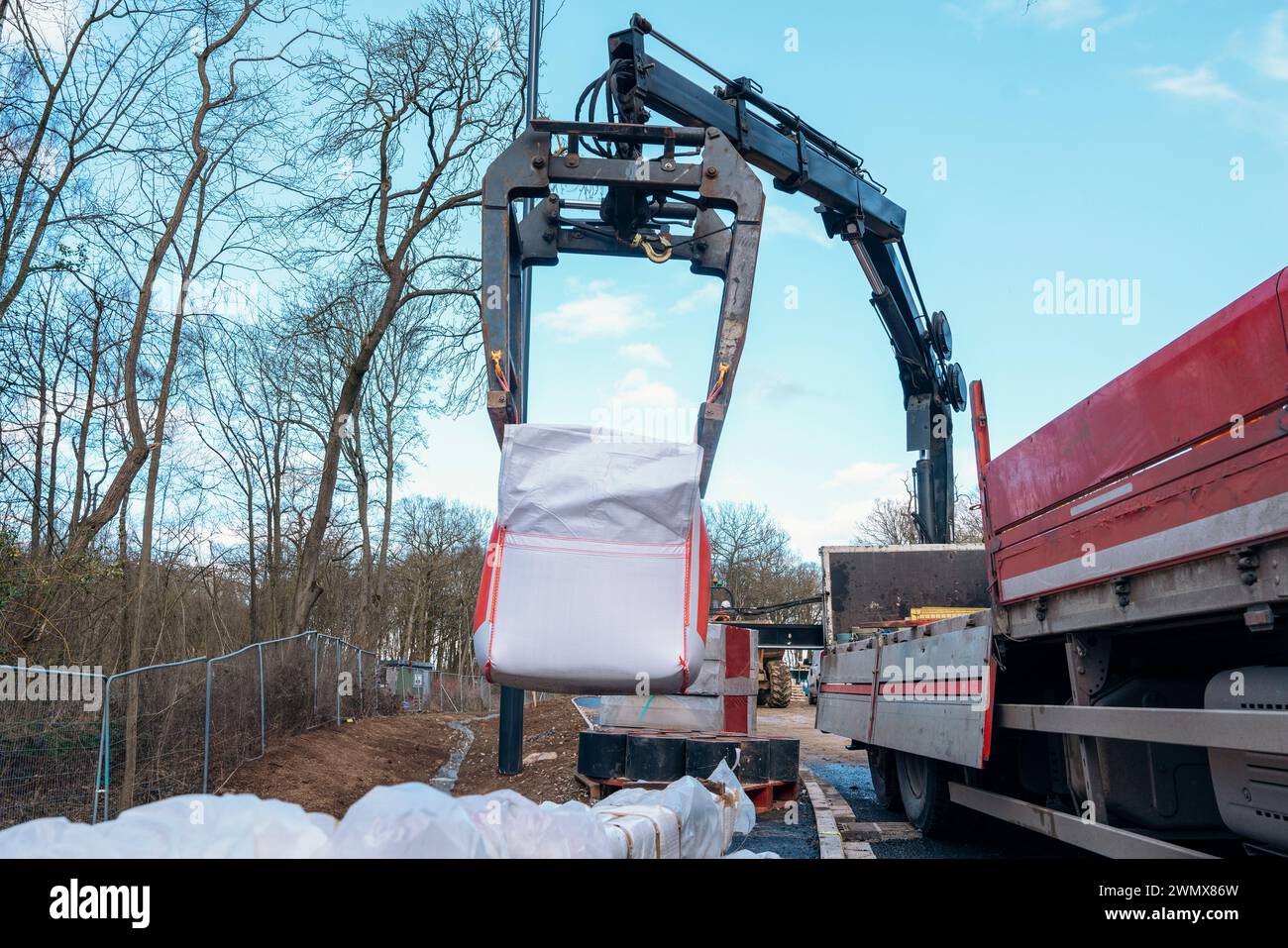 Dropside flatbed HIAB crane lorry with brick grab attachment deliver ...