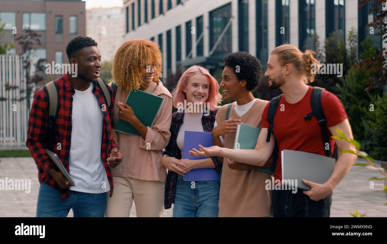 University friendship funny speaking emotional joyful diverse people teens high school pupils ...