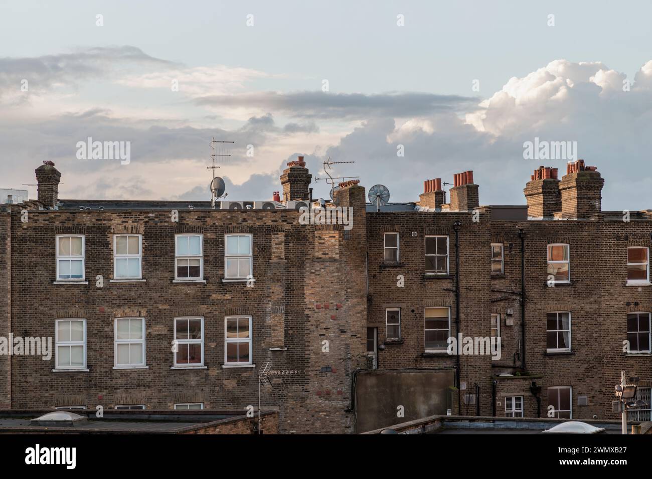 London, UK - Feb 18, 2024 - Rear view of urban brick apartment ...