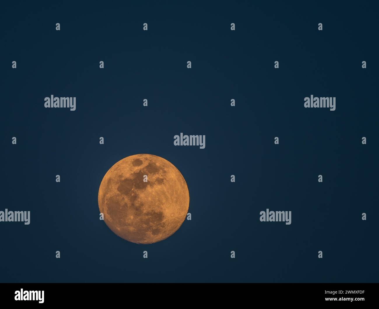 March full moon on a dark blue background as seen from Daejeon, South ...