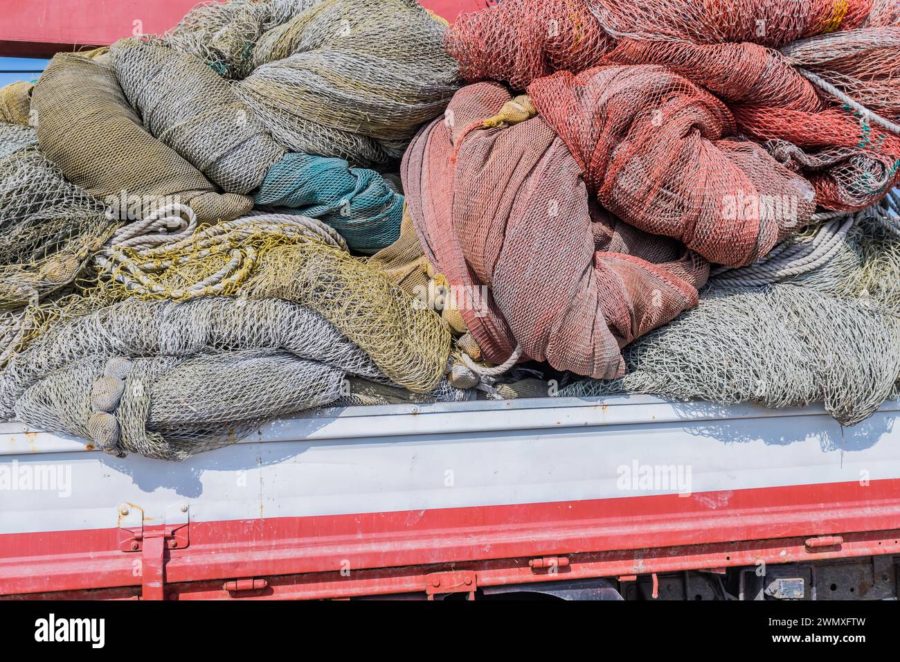Fishing nets rolled up and stacked in bed of large truck in Pyeongtaek ...
