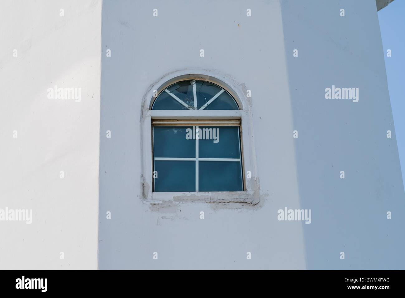 Closeup of arched window on side of white lighthouse in Pyeongtaek ...