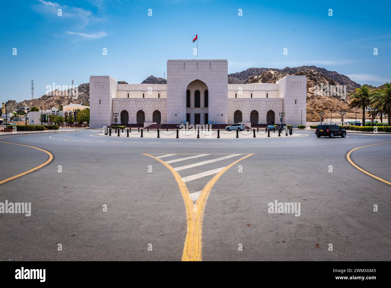 Traditional oriental-style building with mountains in the background ...