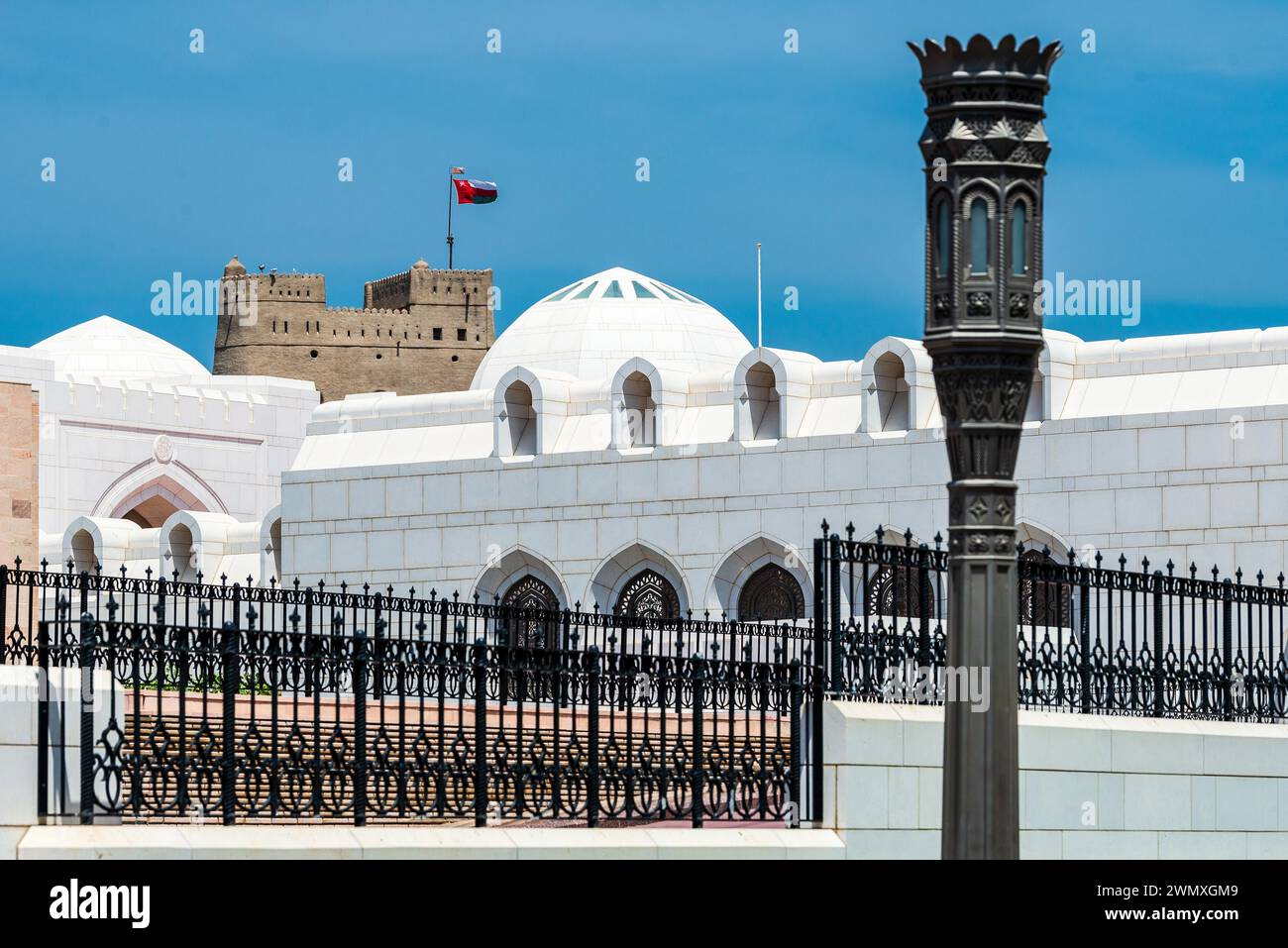 Traditional oriental lantern over a white building with a domed roof ...