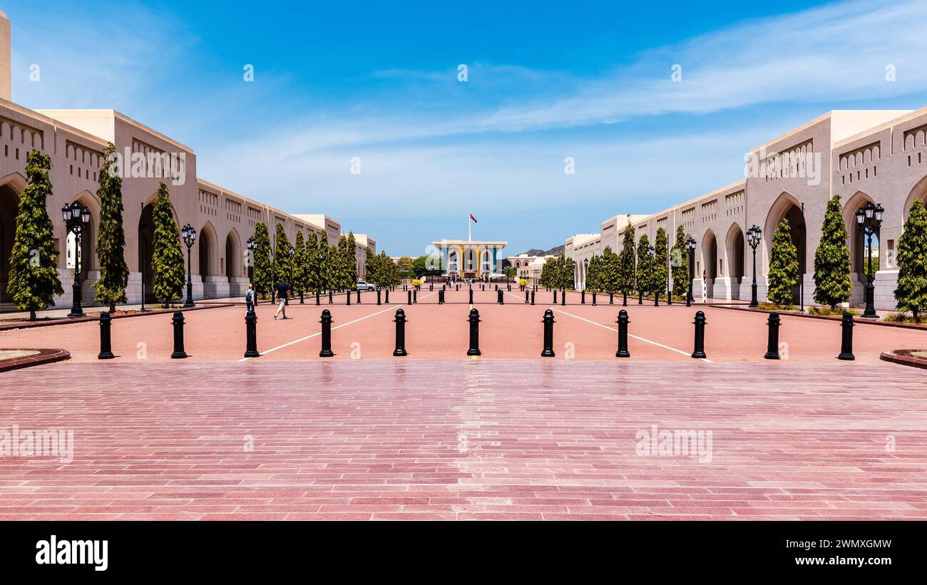 Sunny, symmetrical square with central flag, surrounded by buildings ...