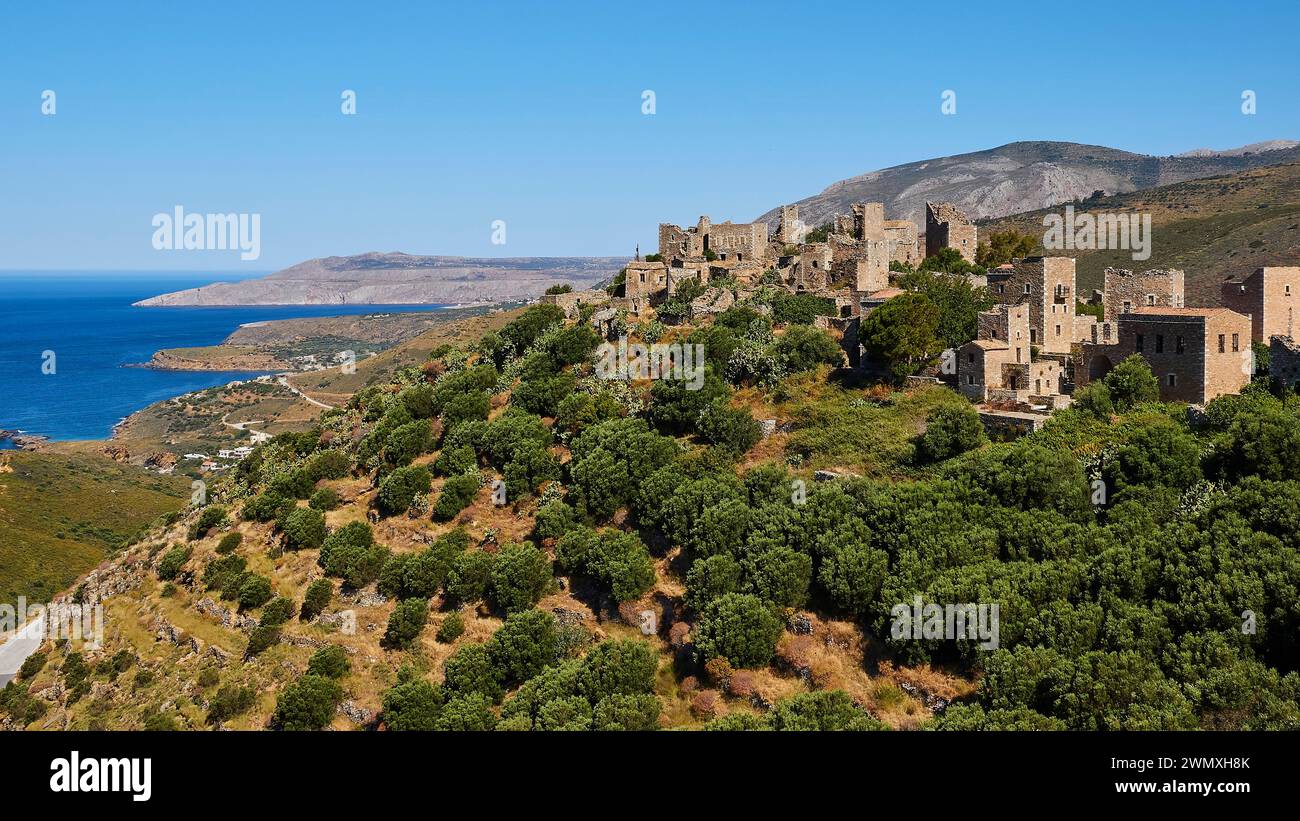 Medieval village overlooking the sea from a wooded hillside, Vathia ...