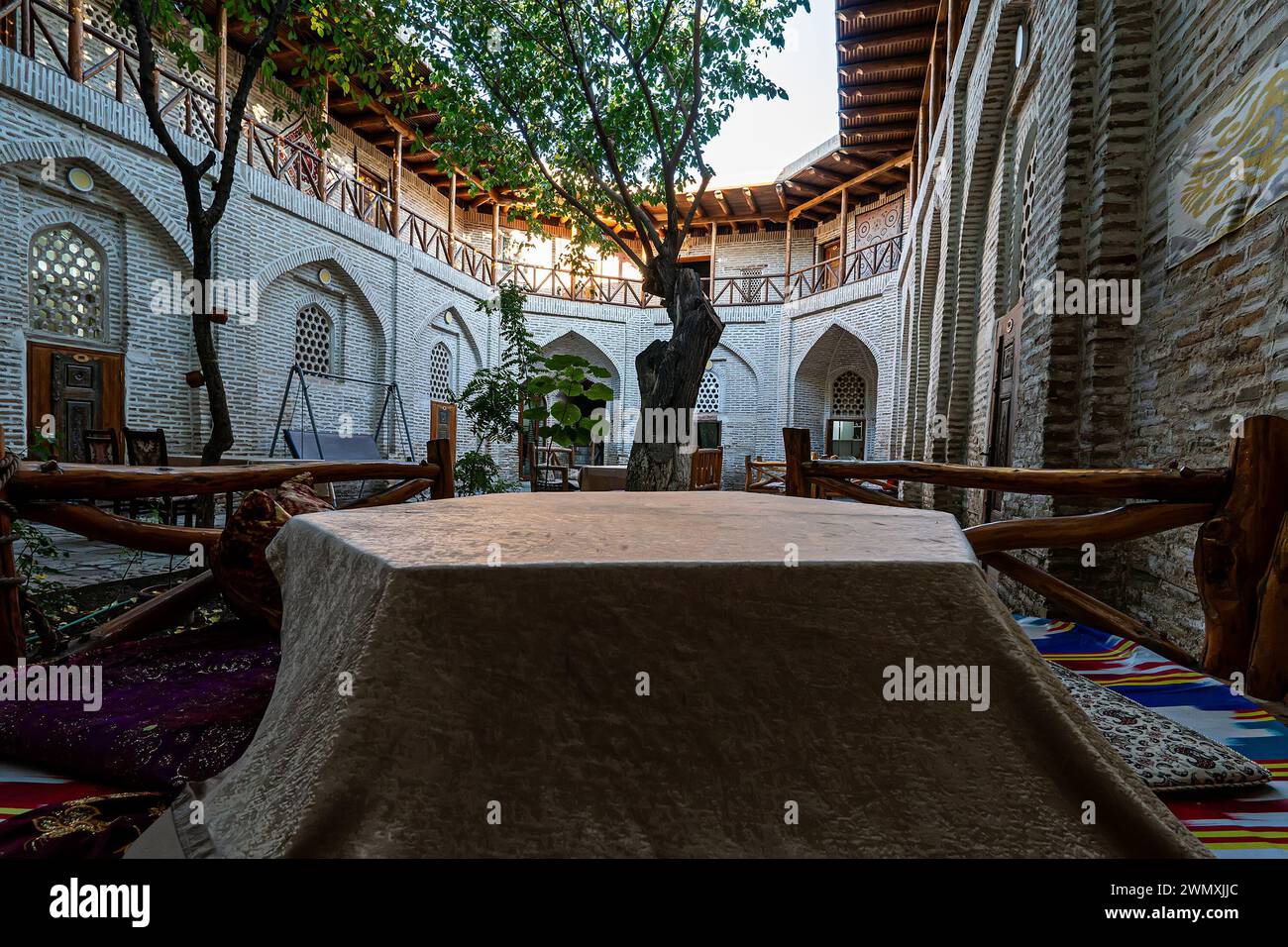a table on a Tapchan inside a medieval caravanserai Stock Photo - Alamy