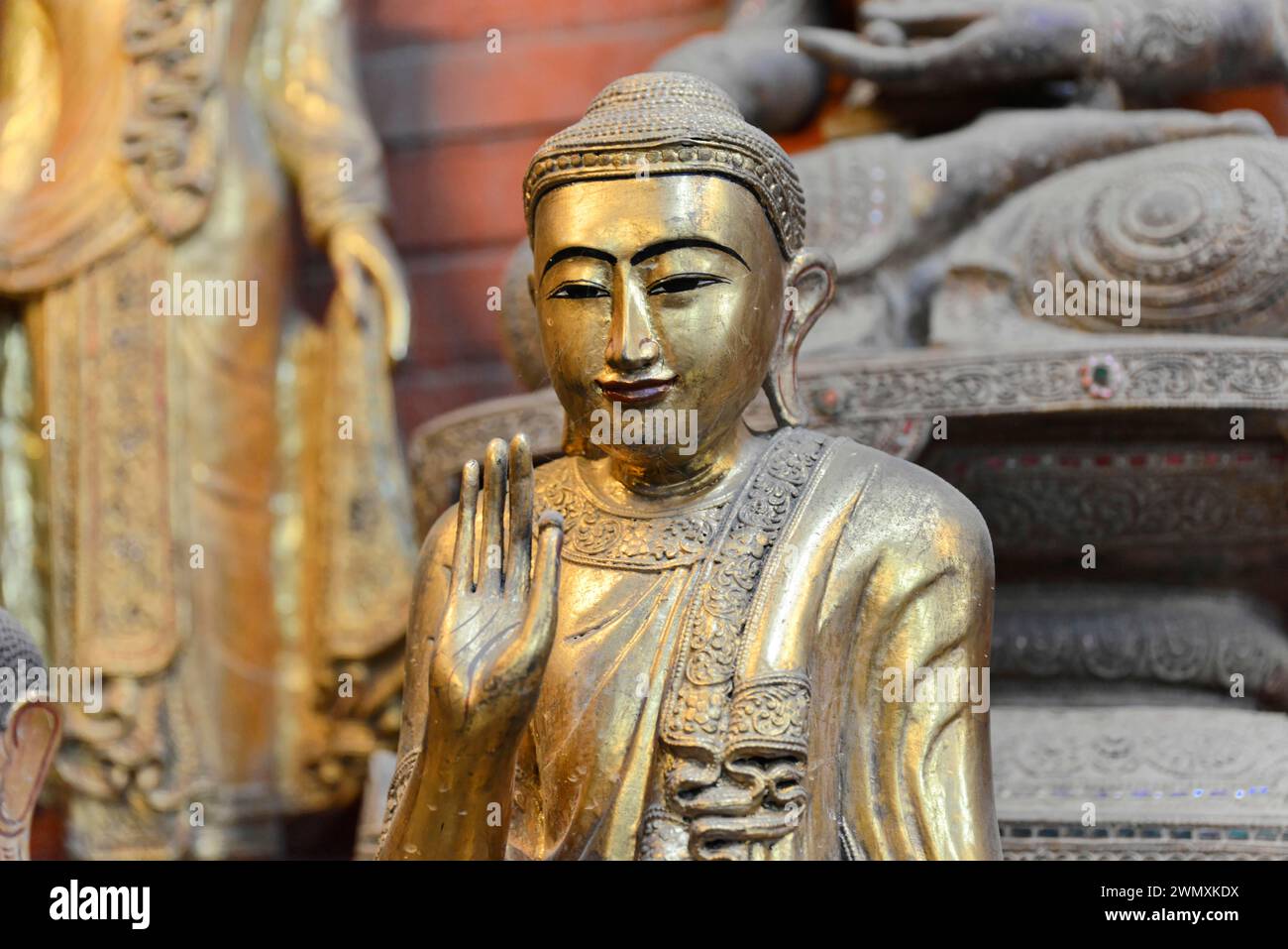Sculptures on display, Buddhas in a shop, Mandalay, Myanmar Stock Photo ...