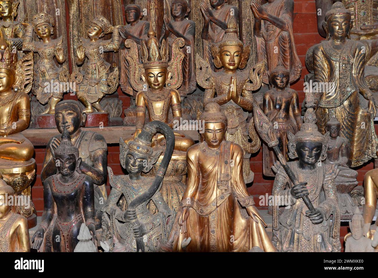 Sculptures on display, Buddhas in a shop, Mandalay, Myanmar Stock Photo ...